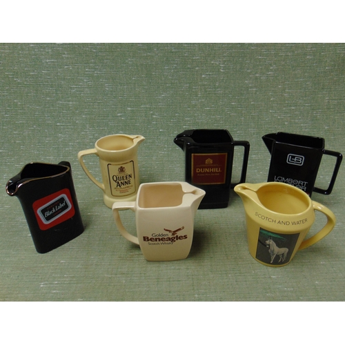 Small collection of advertising water jugs.