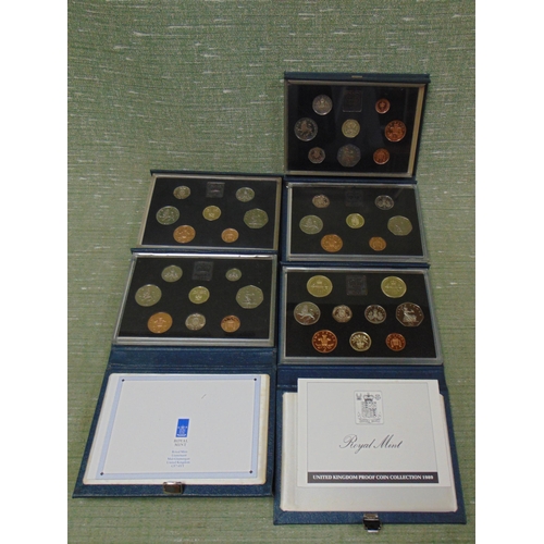 Five cased sets of Elizabeth II proof coin sets.