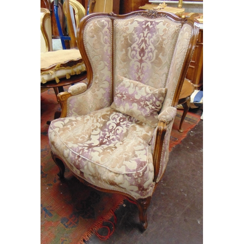 Continental wingback armchair, having all over upholstery and on ...