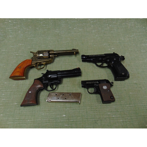 Collection of replica hand guns.