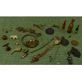 Interesting collection of trinkets, chains, badges, etc.