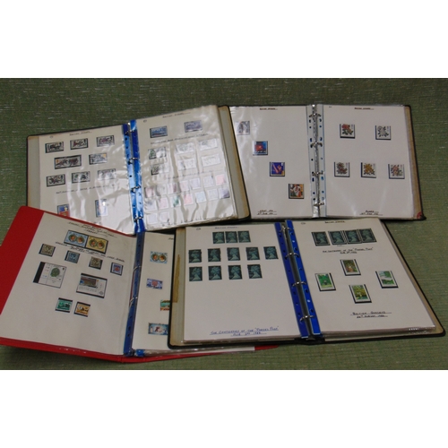 Three stamp albums and contents.