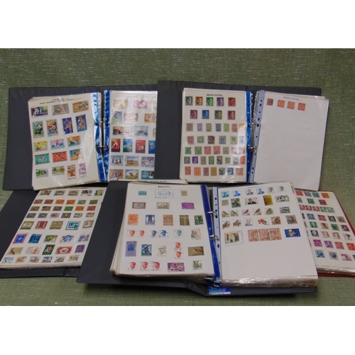 Five stamp albums and contents.