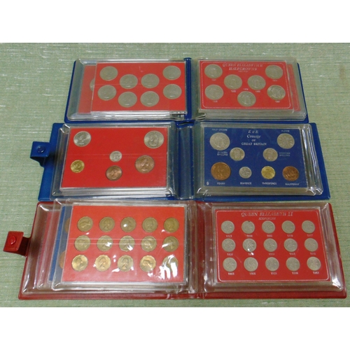 Three commemorative coin albums and contents.