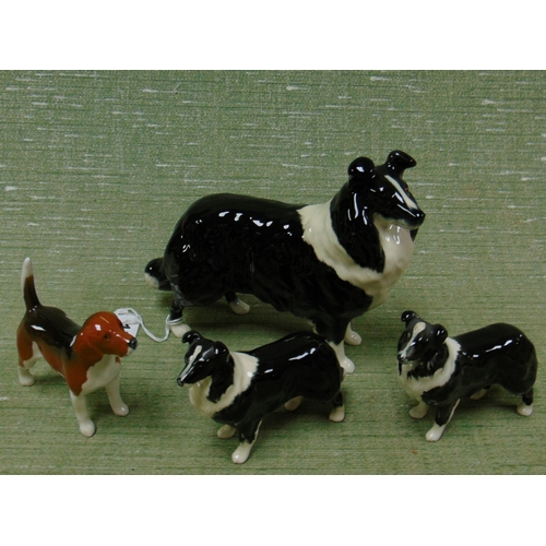 Four Beswick dogs.