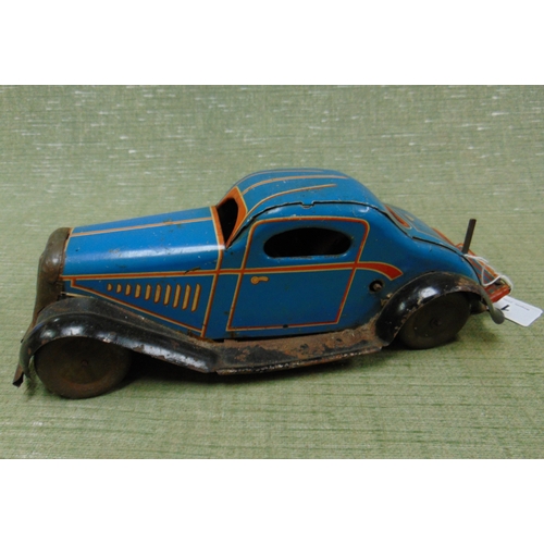 Vintage tinplate clockwork toy car, 12".