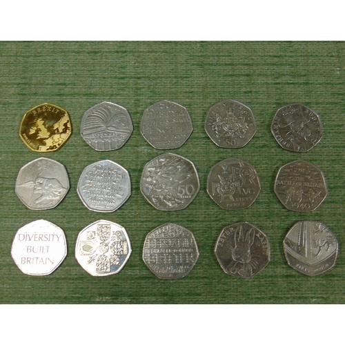 Collection of commemorative 50p coins.