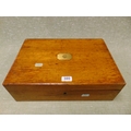 An oak cutlery box and contents.