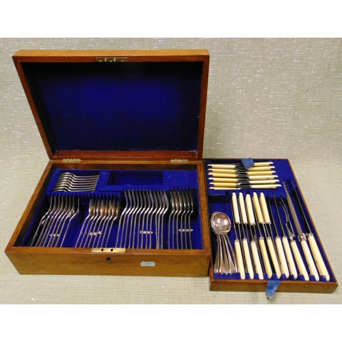 An oak cutlery box and contents.