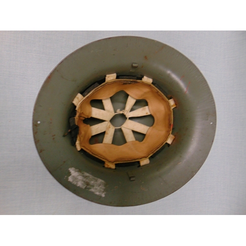 Military tin helmet.
