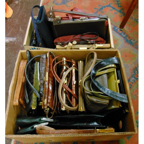 Two boxes of handbags.