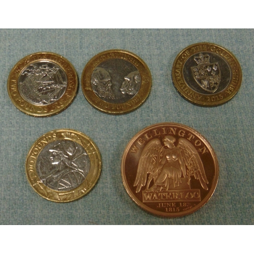 Four uncirculated commemorative 32 coins and a bronze copy of the 1815 ...