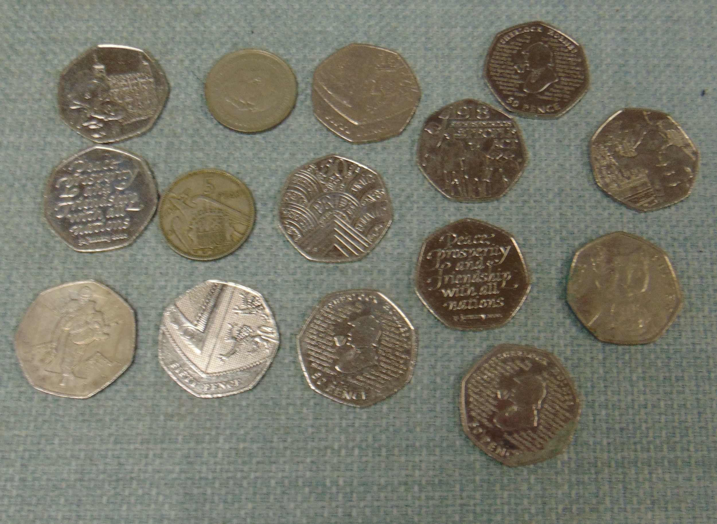 Collection of commemorative 50p coins.
