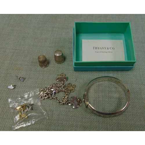 Tiffany silver bracelet, silver bangle and two silver thimbles.