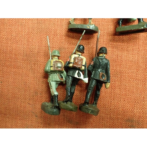 WW2 German, six elastolin figures including SS men MARCHING WITH RIFLE ...