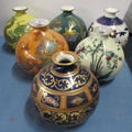 Six Wilton Ware onion shaped vases, all decorated with different ...