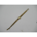 A 9ct Omega ladies watch, with woven bracelet and ladder clasp, stamped ...