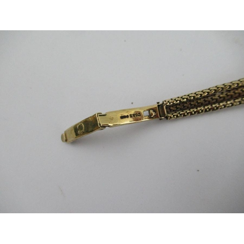 A 9ct Omega ladies watch, with woven bracelet and ladder clasp, stamped ...