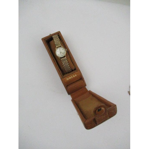 A 9ct gold Omega ladies watch, the cream dial with Arabic numerals ...