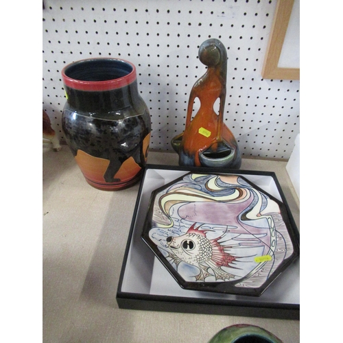 A Black Ryden octagonal plate, decorated with a fish by Bossons ...