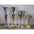 A pair of loaded silver candlesticks, height 7ins, a silver goblet and ...
