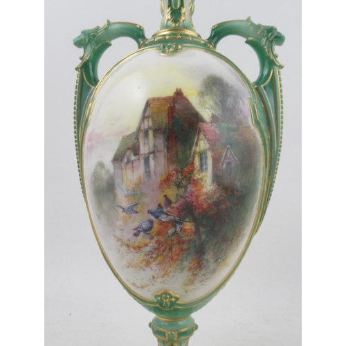 A Royal Worcester covered twin handle pedestal vase, the front ...