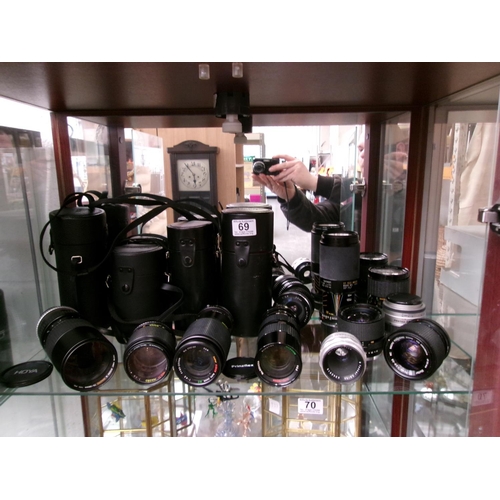 Shelf assorted camera lenses