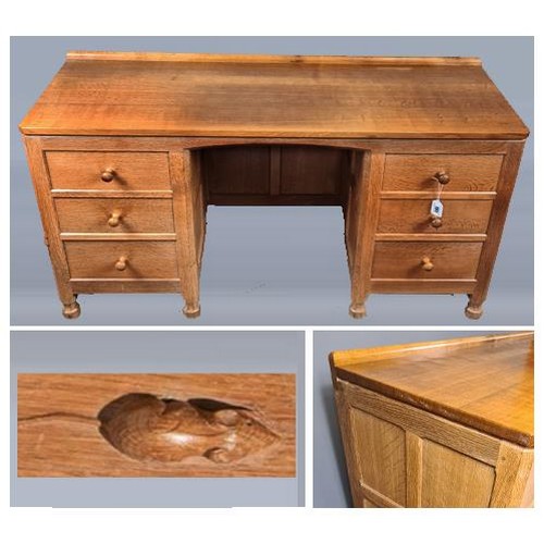 Kneehole desk by Robert "Mouseman" Thompson, circa 1930's, having adzed ...