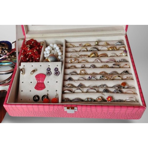 Over 60 rings and other jewellery items together with a pink jewellery ...