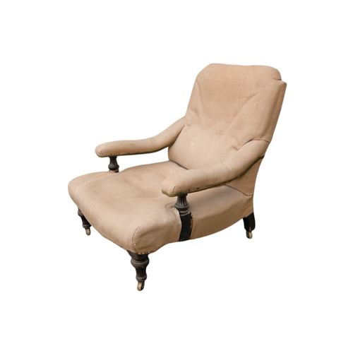 A late Victorian ebonised low chair - the upholstered back above open ...