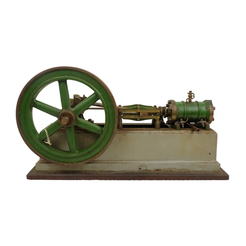 A large single cylinder horizontal steam engine - green painted, raised ...