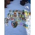 A collection of assorted trading cards, including sports-themed cards ...