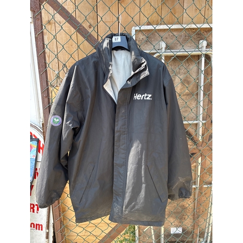 Hertz-branded black jacket with a front zipper, side pockets, and logo ...