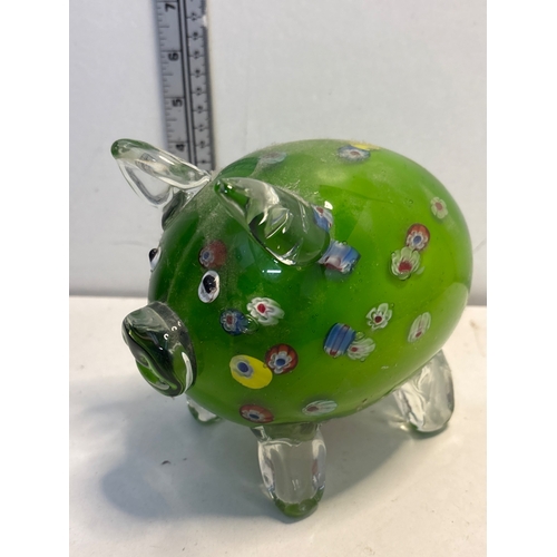 Handcrafted green glass pig with millefiori detail.