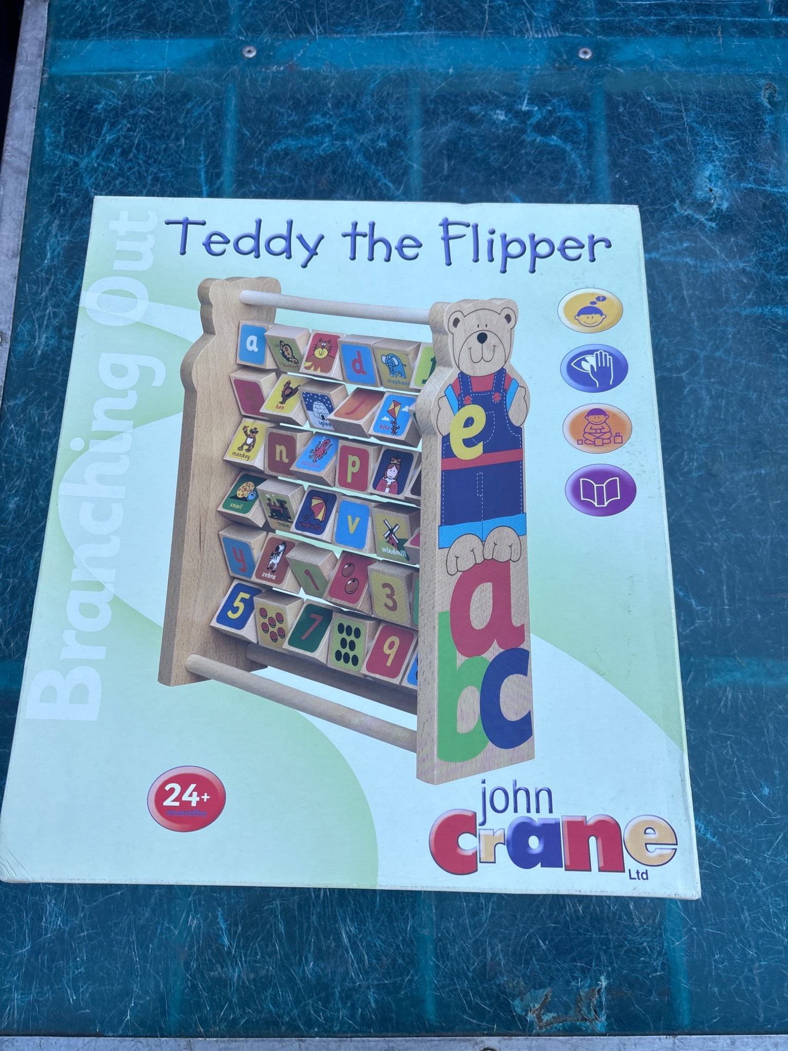 John Crane Teddy the Flipper wooden alphabet toy, age 24+ months.