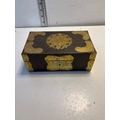 Rectangular wooden box featuring ornate brass inlays on the corners and ...