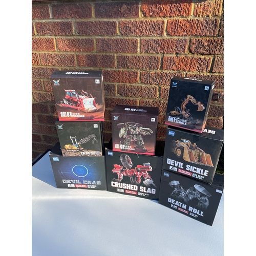 Seven robot model kits in original packaging.