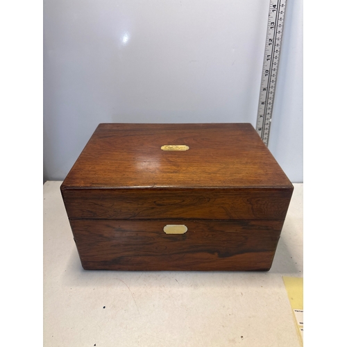 Wooden writing box featuring brass inlays and an engraved plaque ...