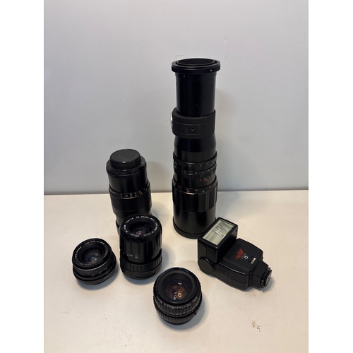 Multiple camera lenses and a flash unit.