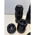 Multiple camera lenses and a flash unit.