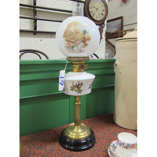 Porcelain and brass hand painted oil lamp complete with shade and funnel.