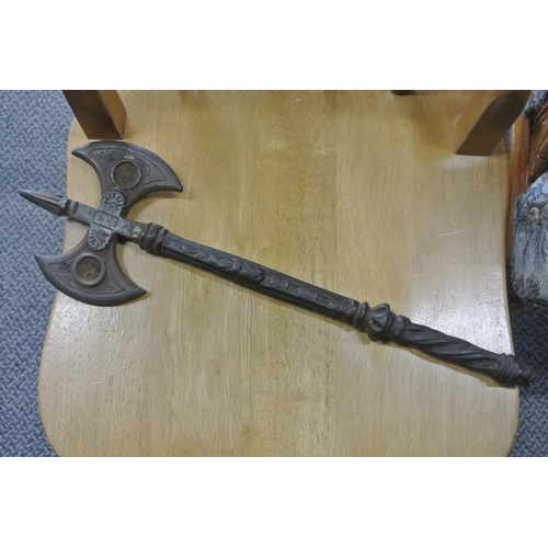 A vintage cast iron axe, measuring 50cm long.
