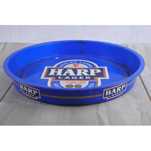 A vintage Harp Larger pub tray.