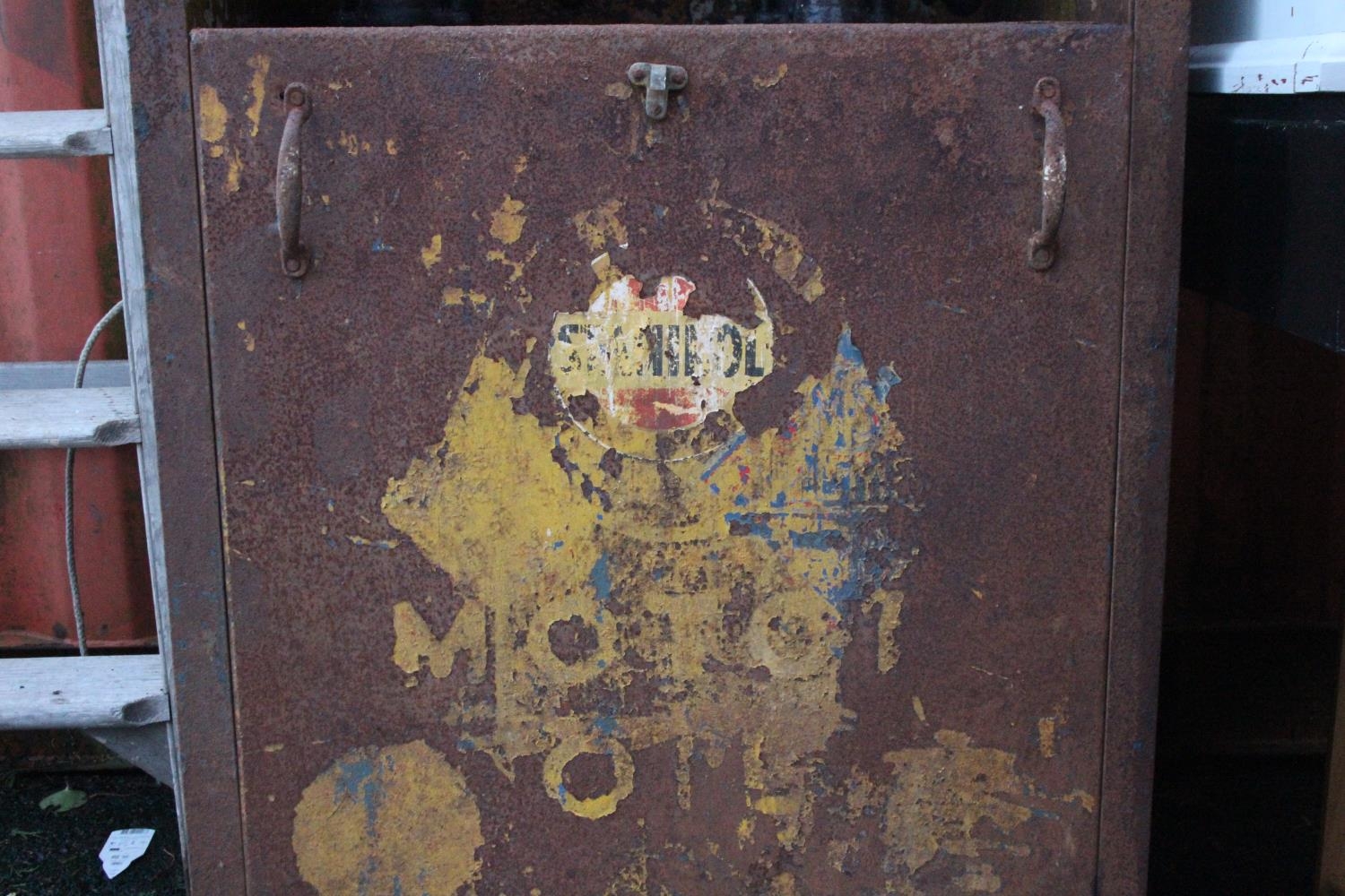 A vintage Staminol Motor Oil cabinet with 2 pumps.