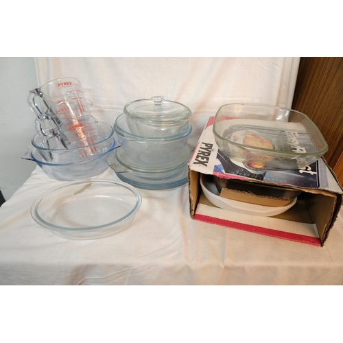 A large lot of Pyrex jugs, bowls and more.