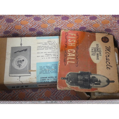 A fishing box containing two wooden fishing reels, a boxed 'The Red ...