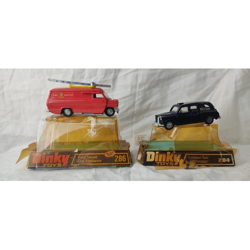 Two vintage boxed Dinky Toys - 284 London Taxi and 286 Ford Transit ...