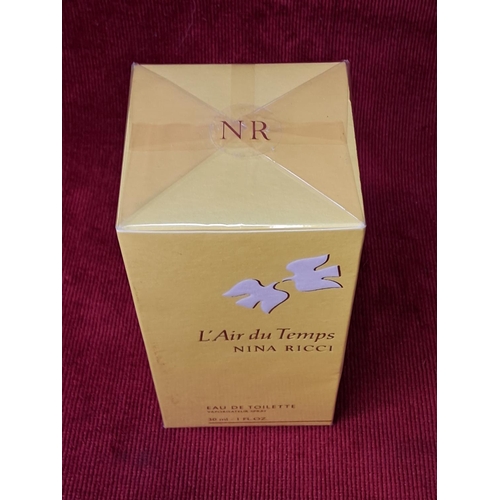 A new unopened bottle of L'Air du Temps perfume.