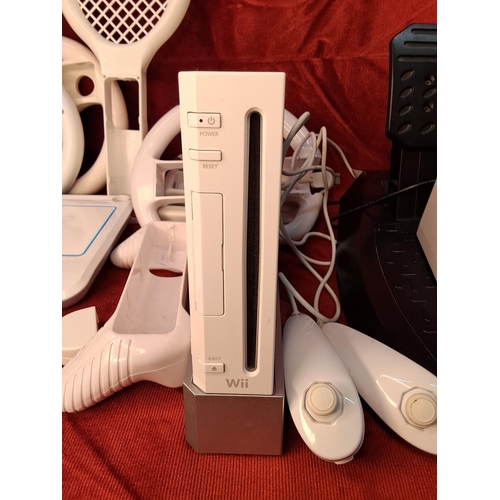 A Nintendo Wii console, foot pedal, games etc.