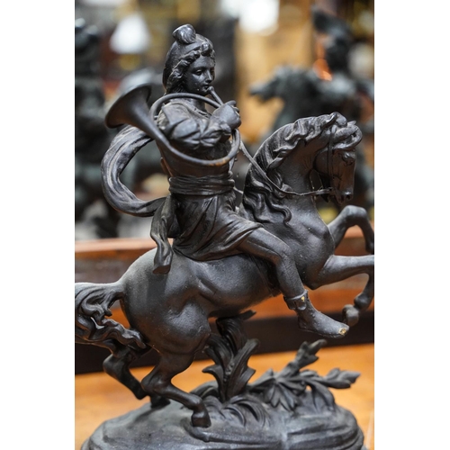 A pair of antique style spelter figures on horseback.